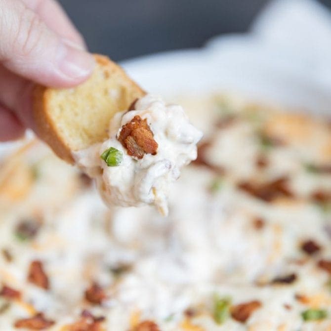 Ooey Gooey Cheesy Hot Bacon Dip served with Crostini